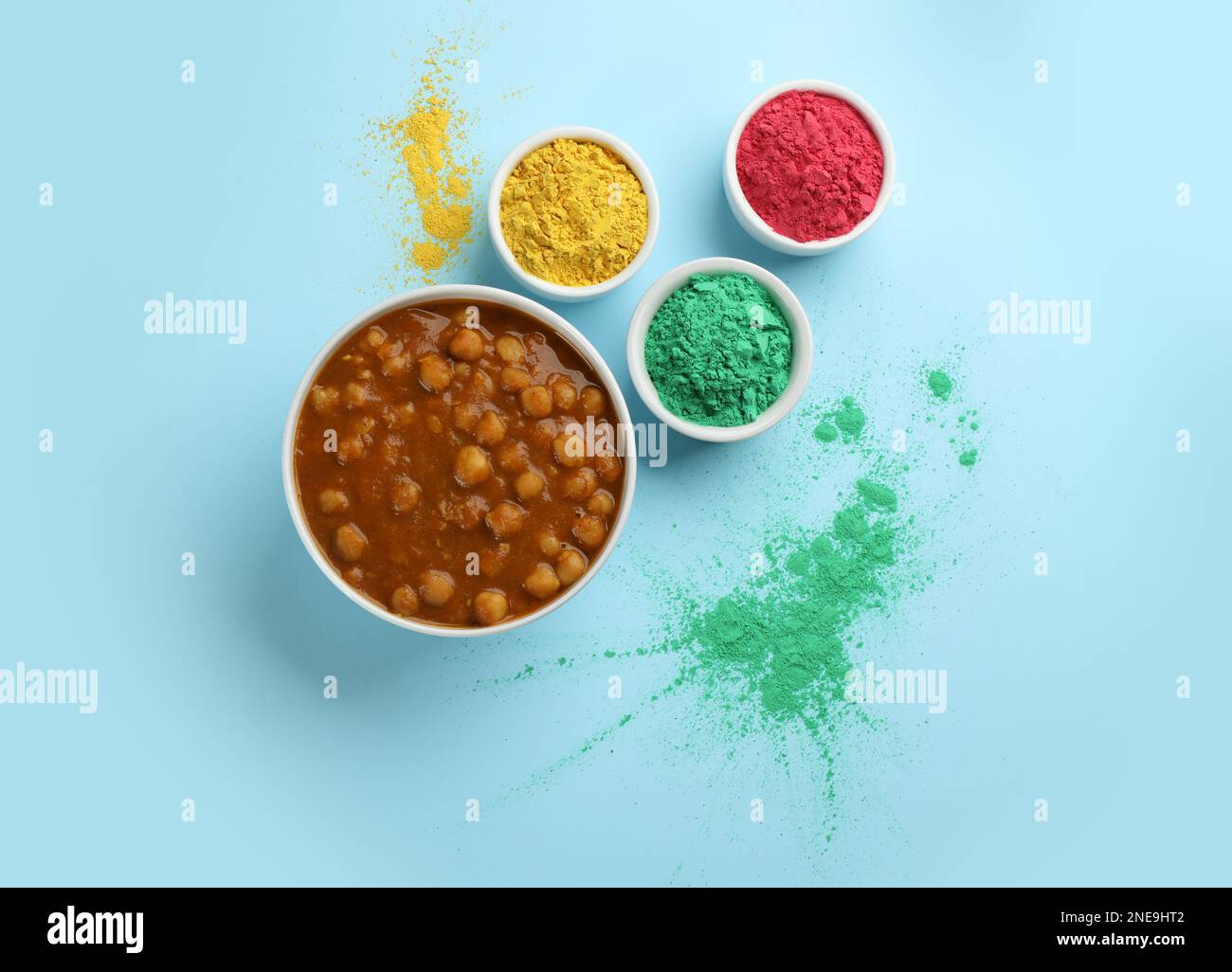 Traditional Indian food and color powder dyes on turquoise background ...