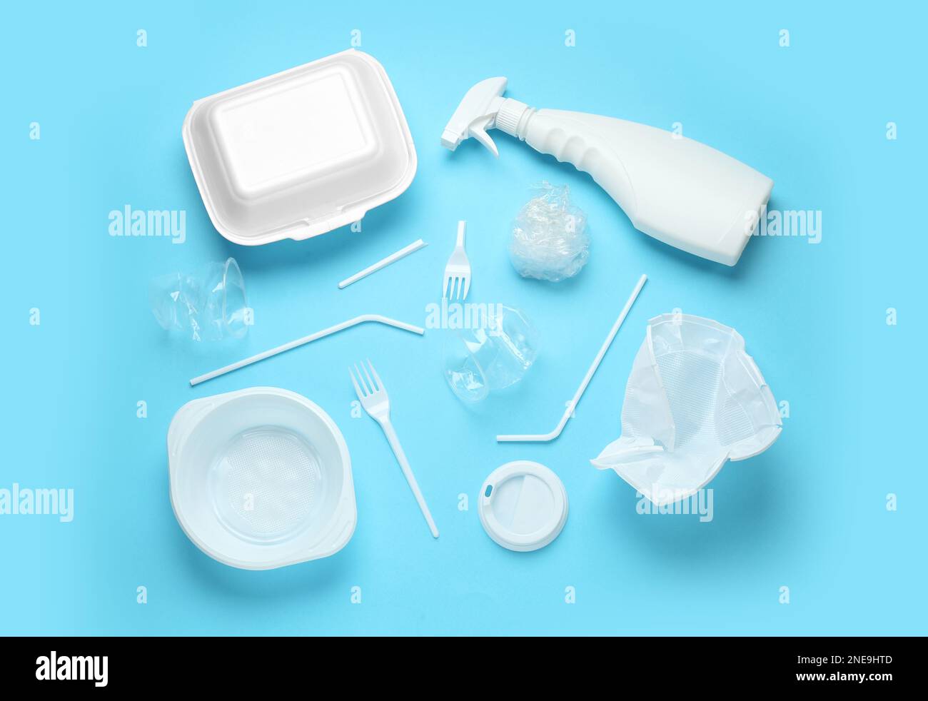 Different plastic items on light blue background, flat lay Stock Photo ...