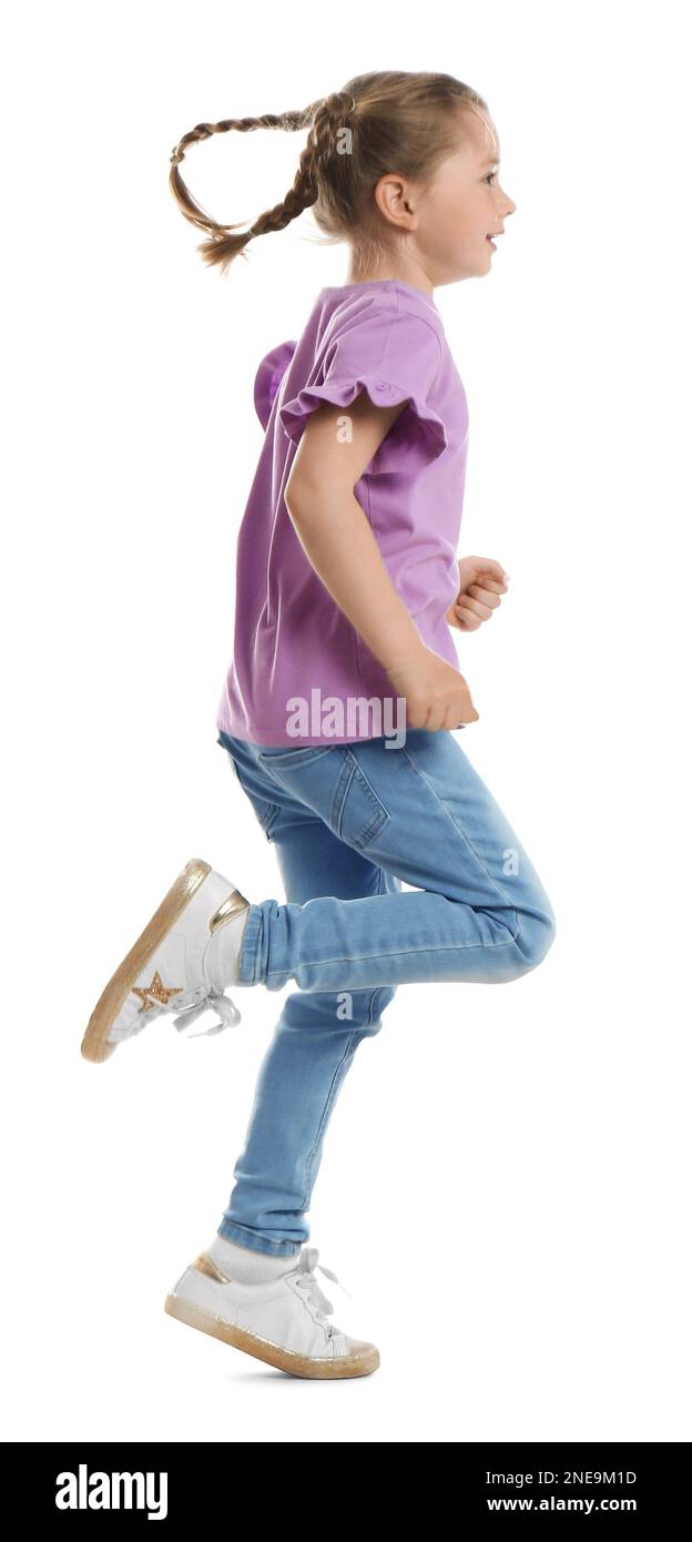 Cute little girl running on white background Stock Photo - Alamy