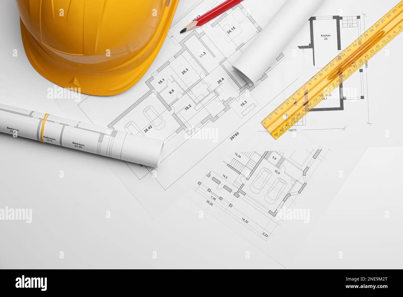 Flat lay composition with blueprints and hardhat on white background ...
