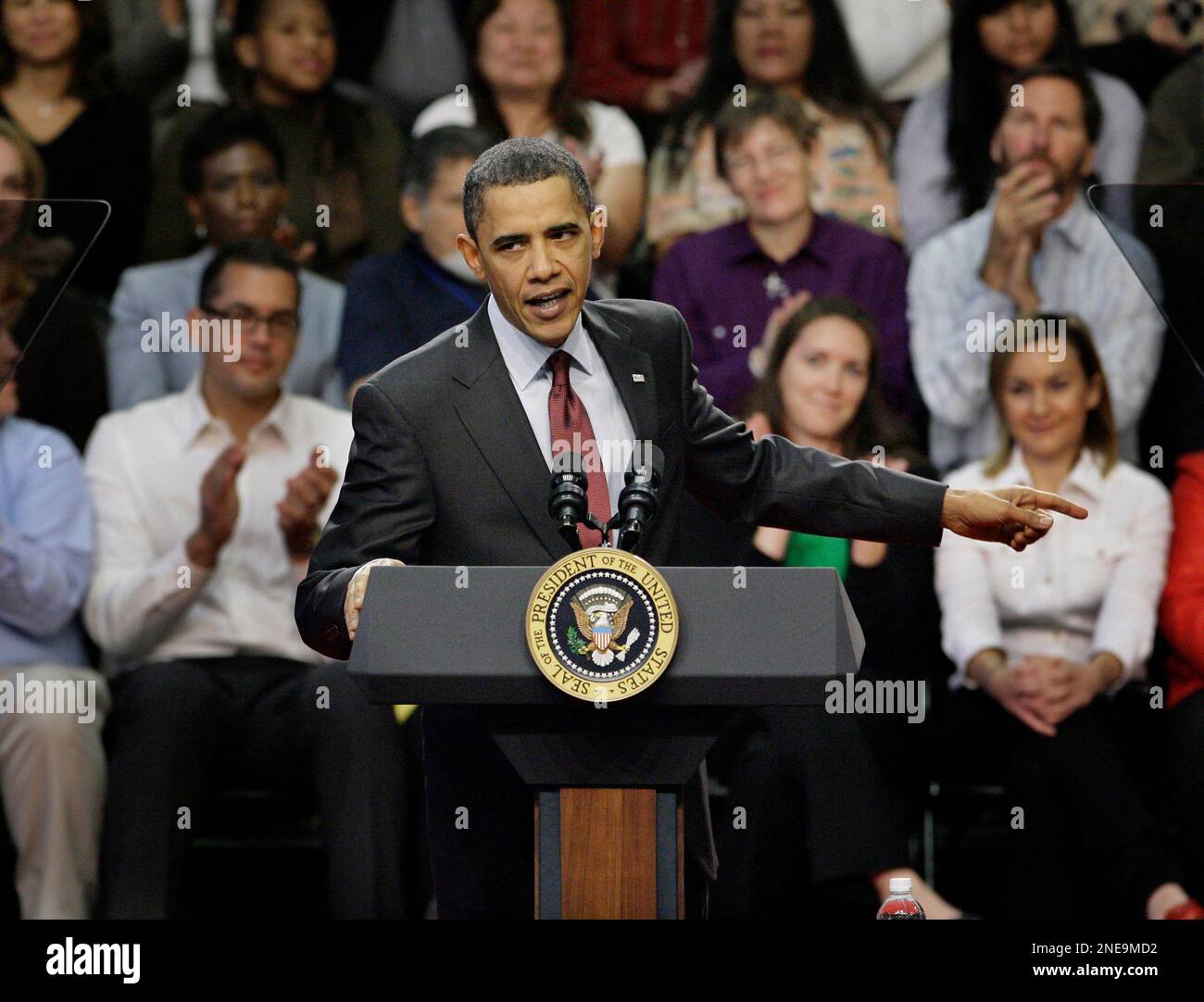 President Barack Obama gestures while speaking at a town hall meeting ...