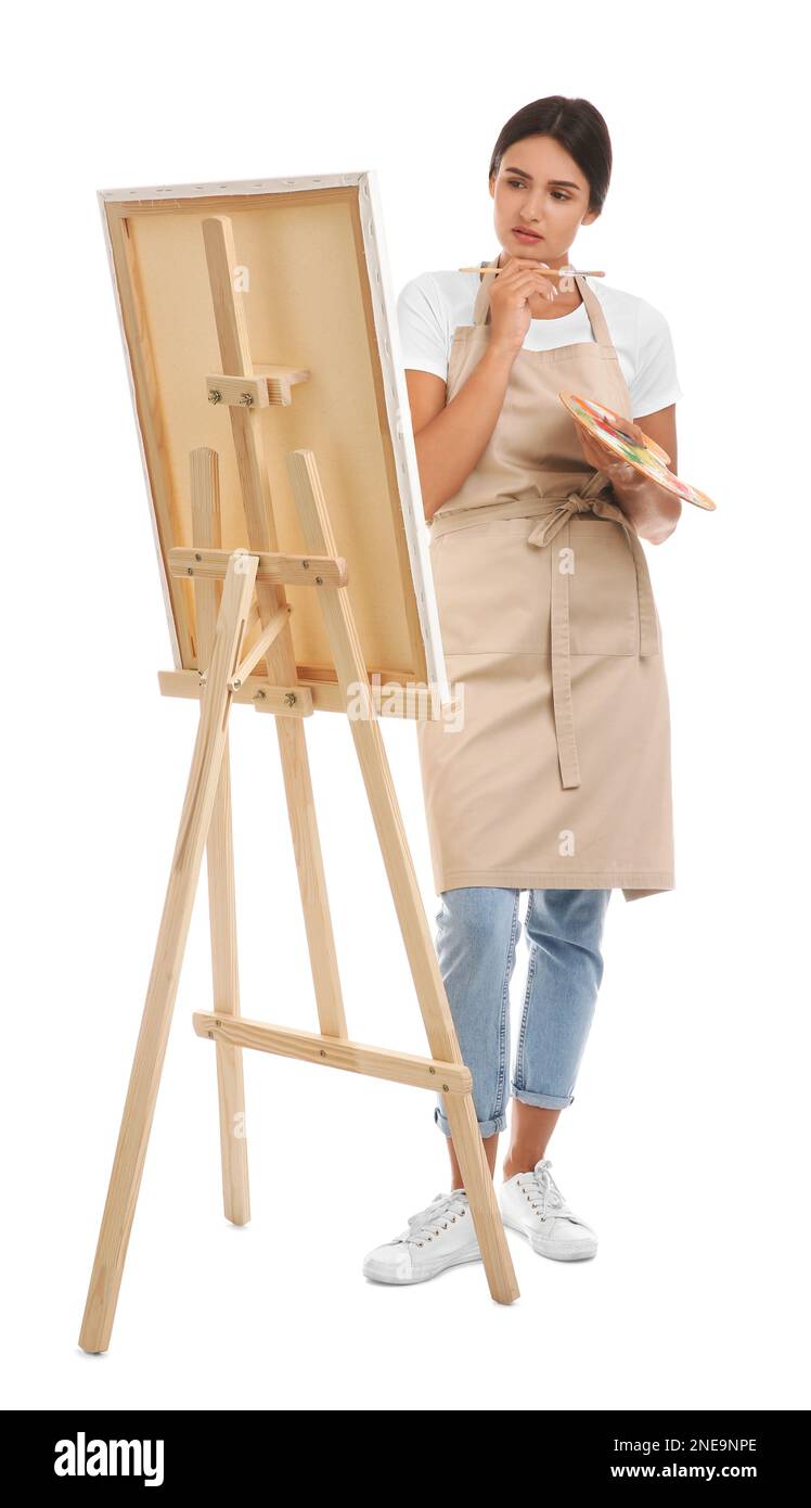Young woman drawing on easel against white background Stock Photo - Alamy