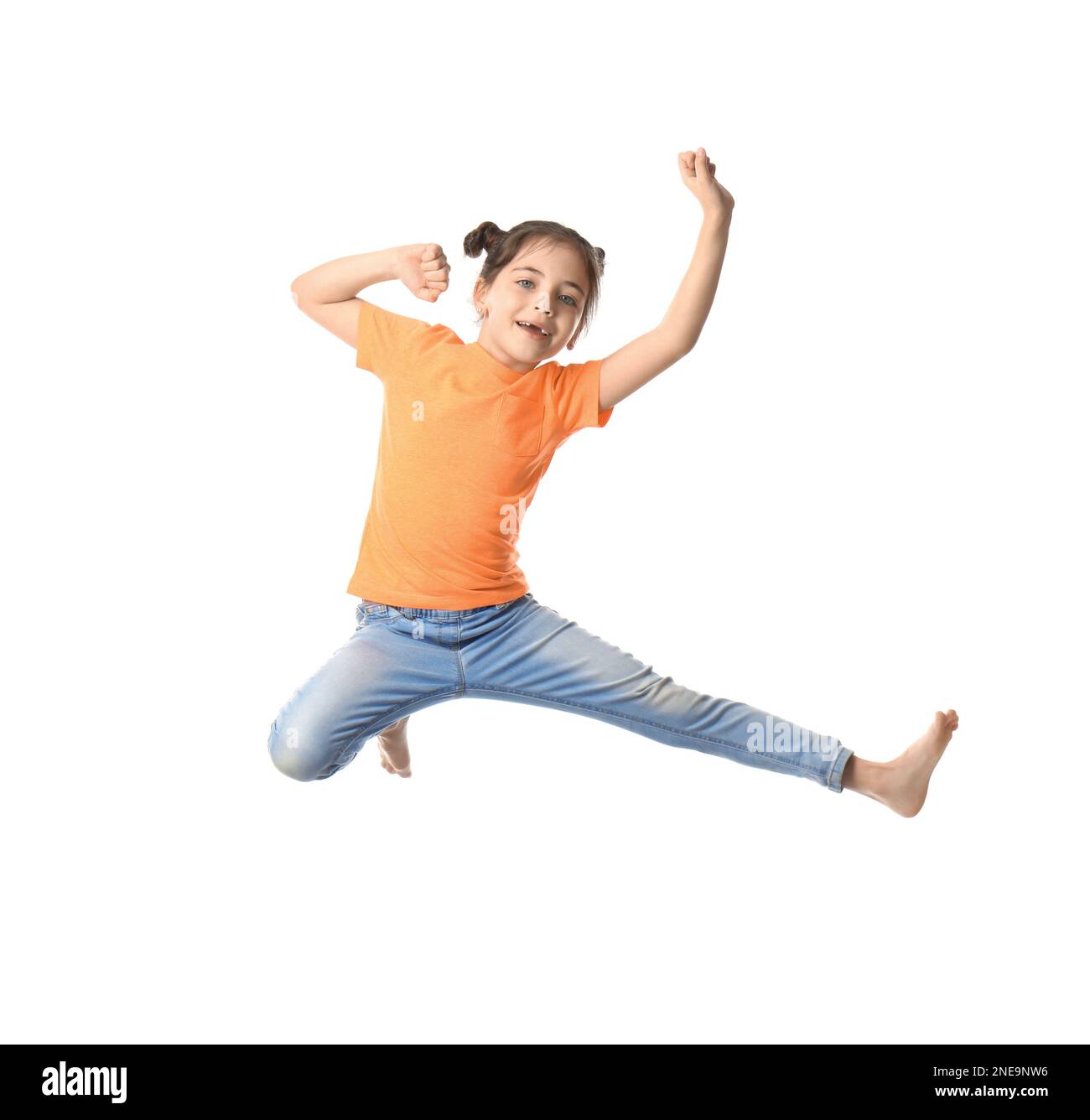 Cute little girl jumping on white background Stock Photo - Alamy