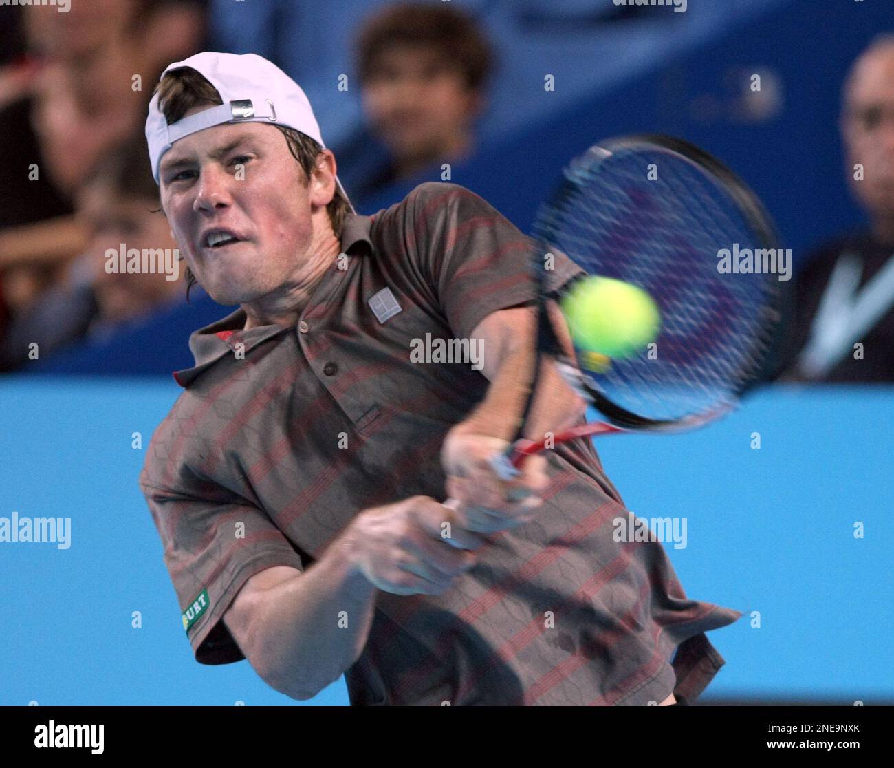 Illya Marchenko of Ukraine returns to Jo-Wilfried Tsonga of France ...