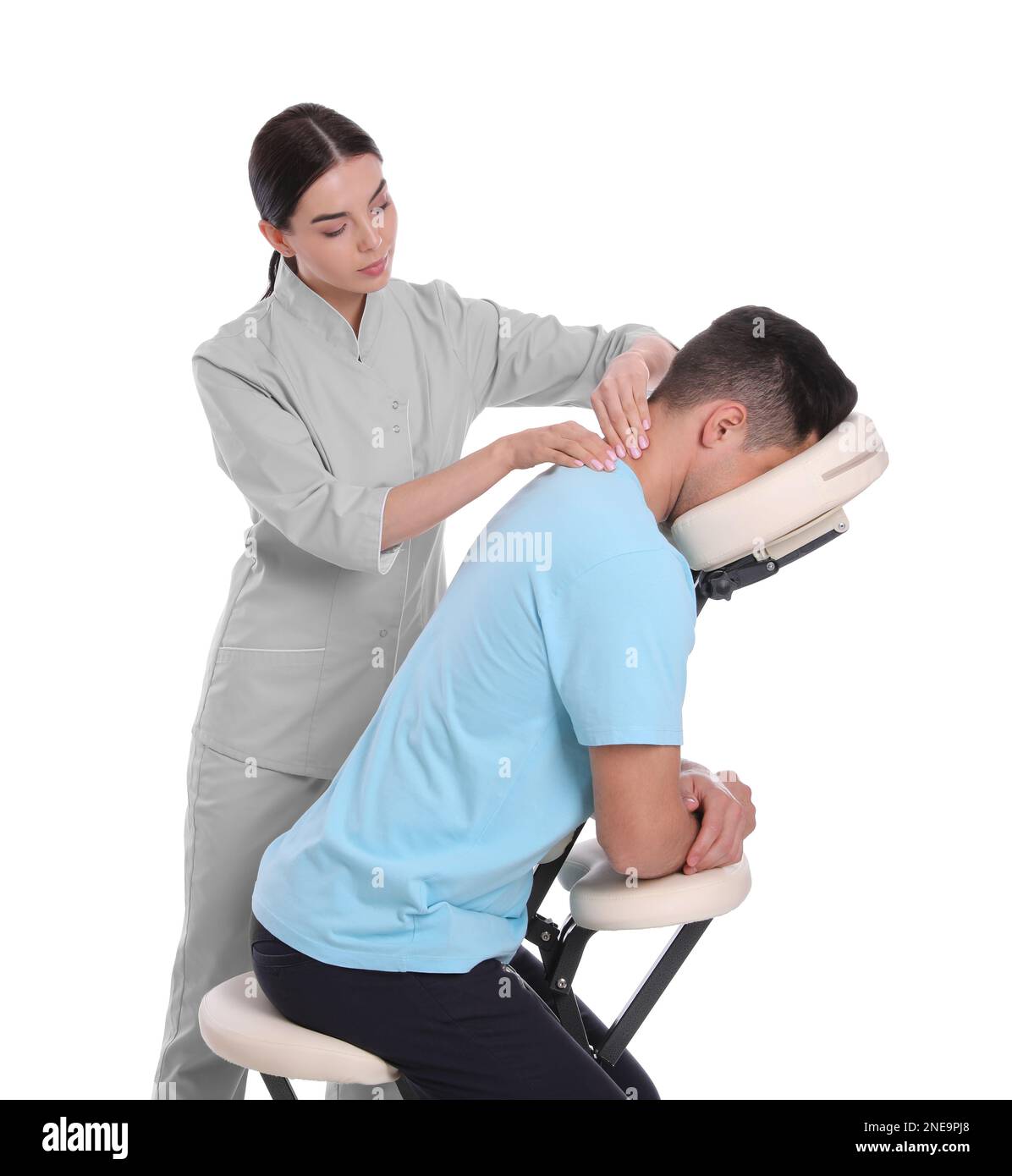 Man receiving massage in modern chair on white background Stock Photo ...
