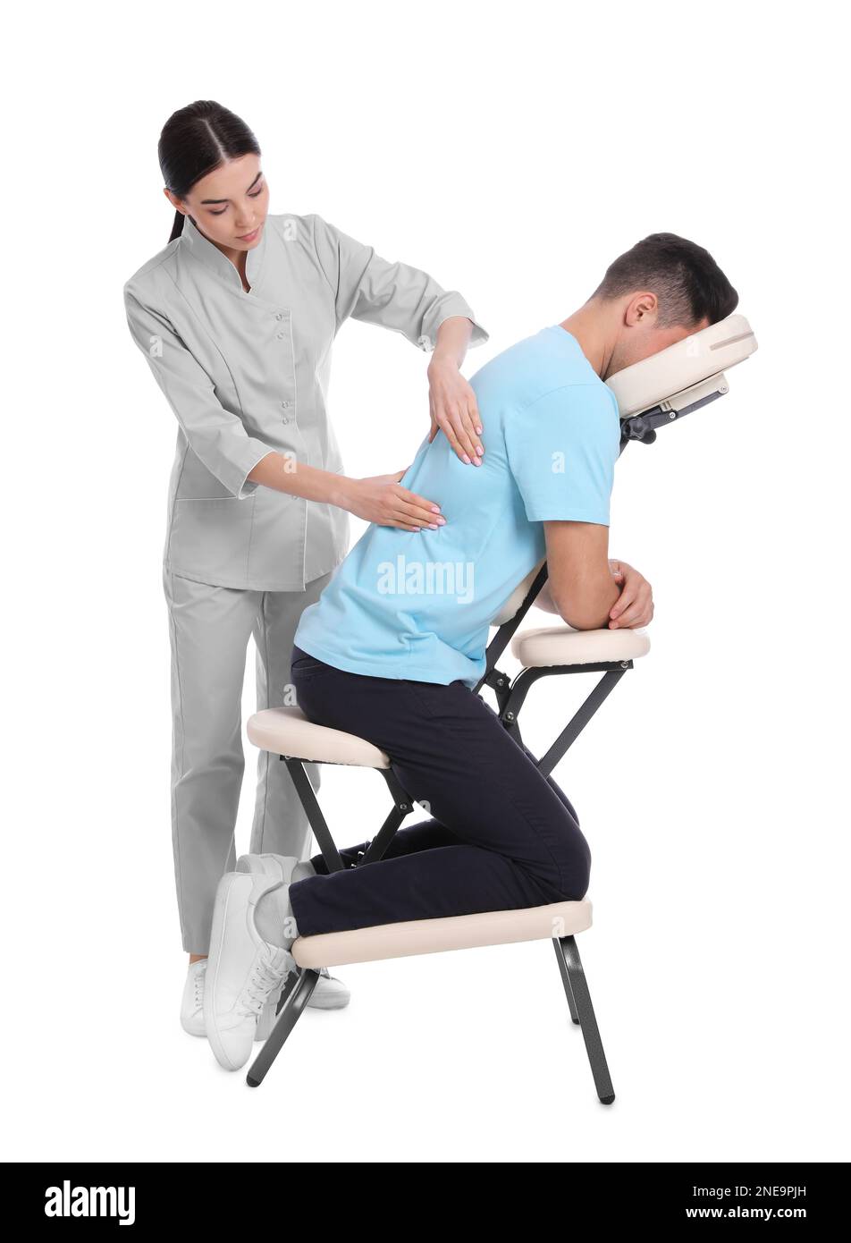 Man receiving massage in modern chair on white background Stock Photo ...