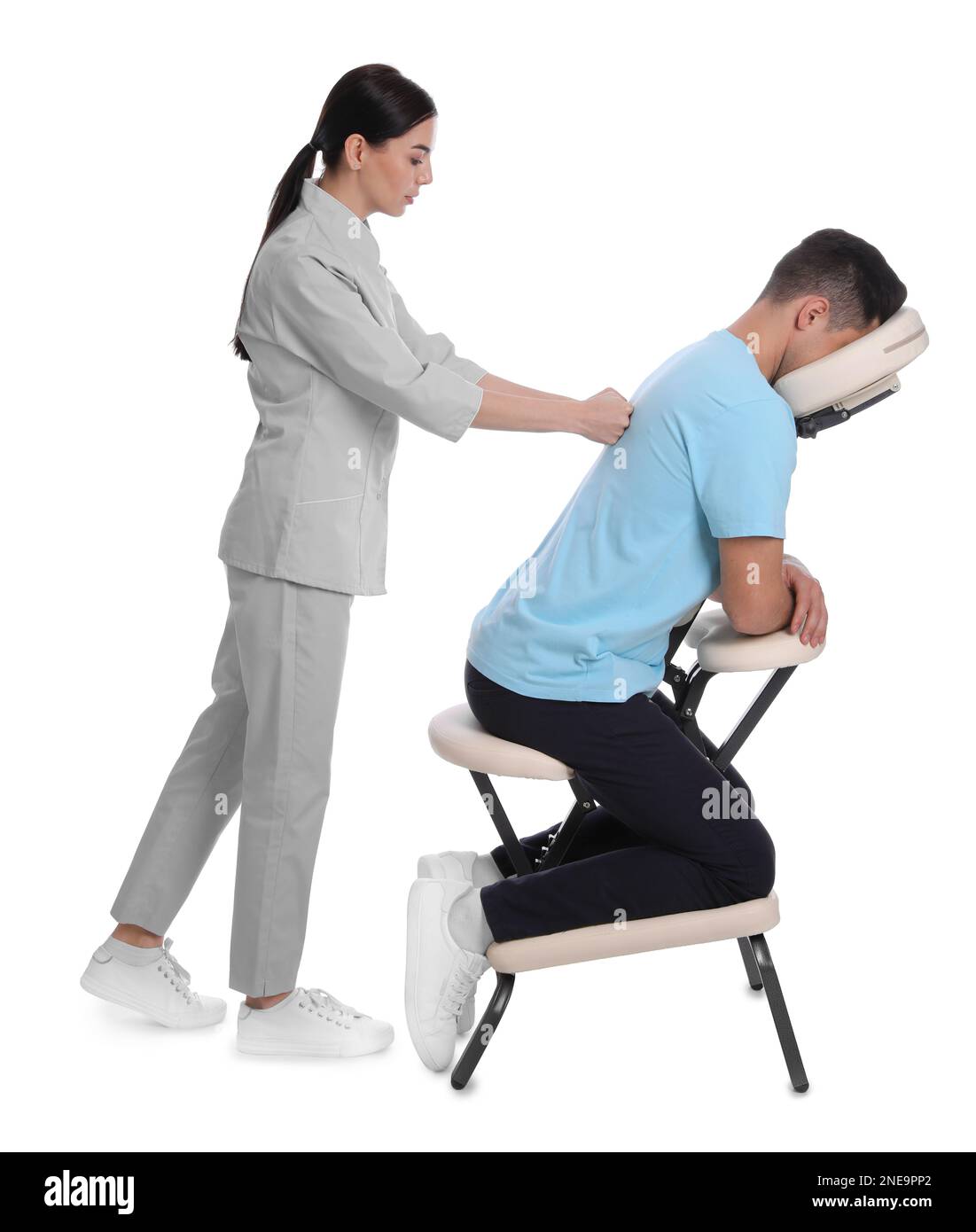 Man receiving massage in modern chair on white background Stock Photo ...