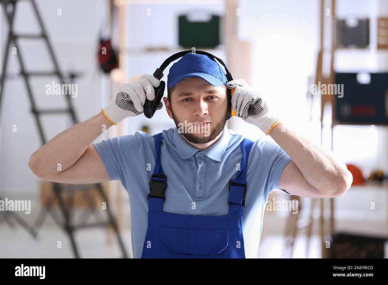 Worker Wearing Safety Headphones Indoors Hearing Protection Device