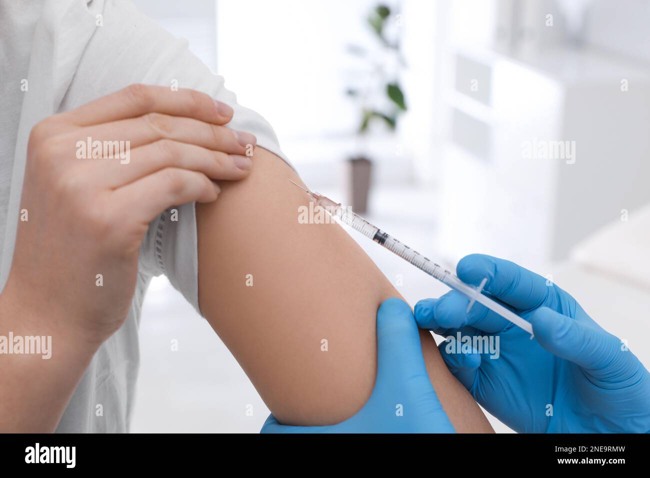 Doctor giving injection to woman in hospital, closeup. Immunization ...