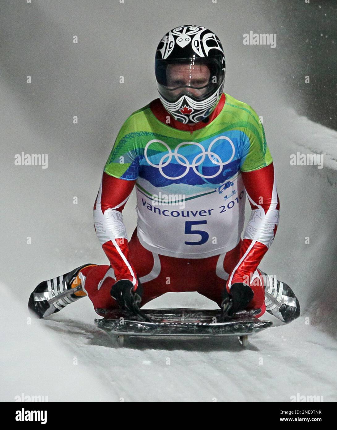 Jon Montgomery of Canada brakes in the finish area after competing ...