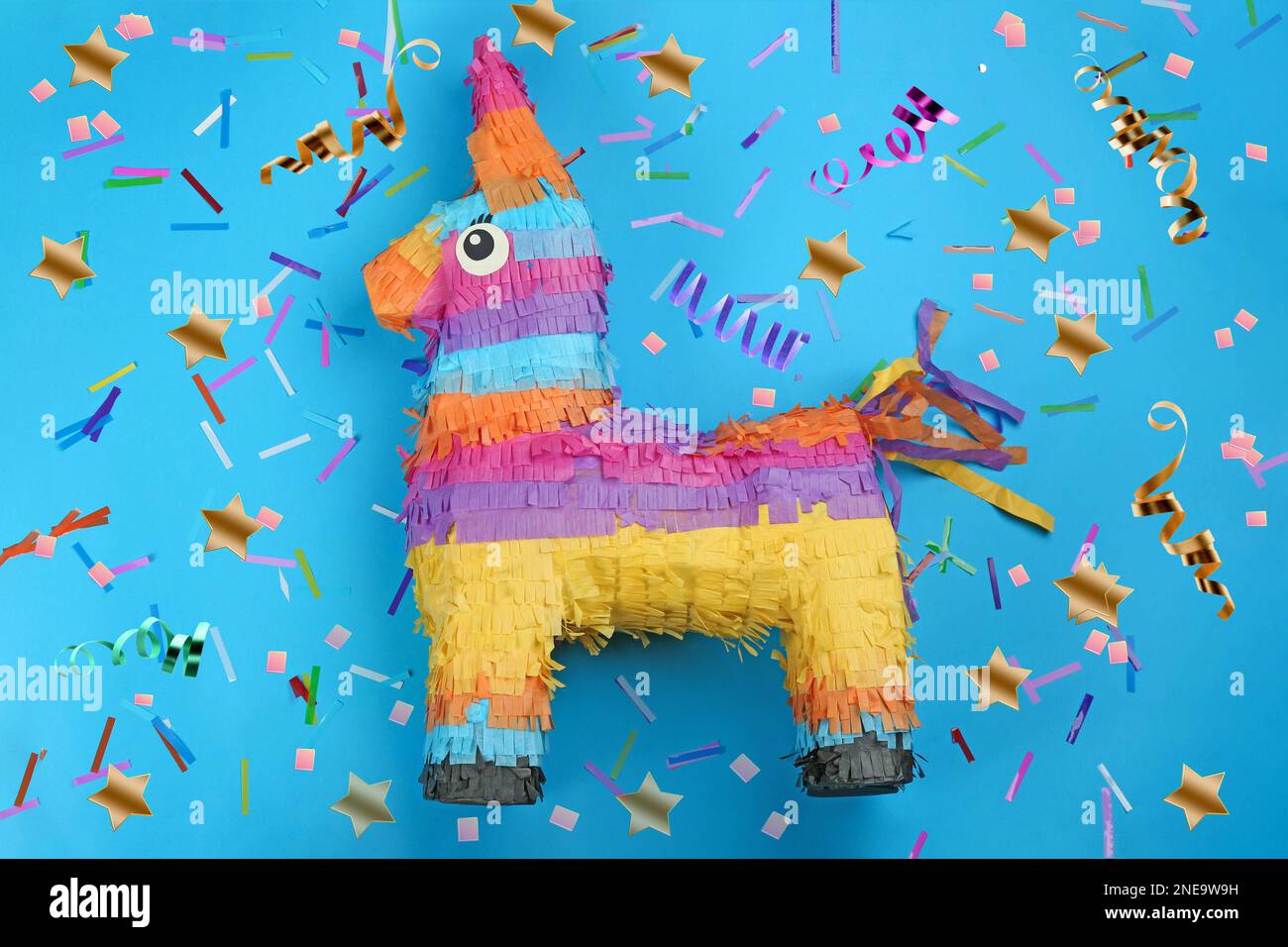 Bright funny pinata and party decor on blue background, flat lay Stock ...