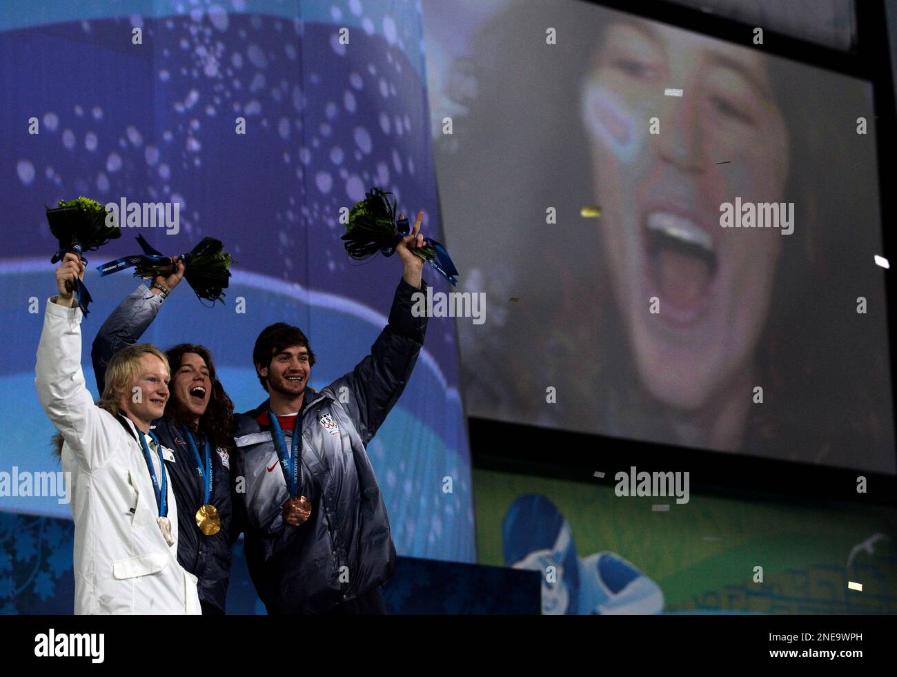 USA's gold medalist Shaun White is flanked by Finland's silver medalist ...