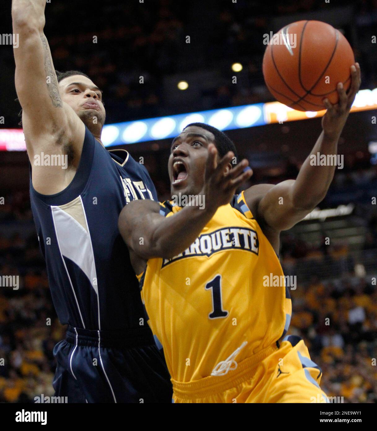 Marquette's Darius Johnson-Odom, right, drives to the basket against ...
