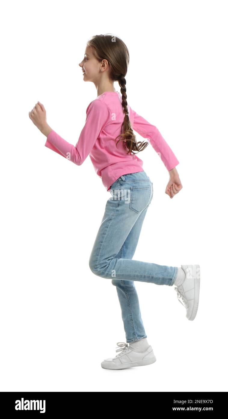 Cute little girl running on white background Stock Photo - Alamy