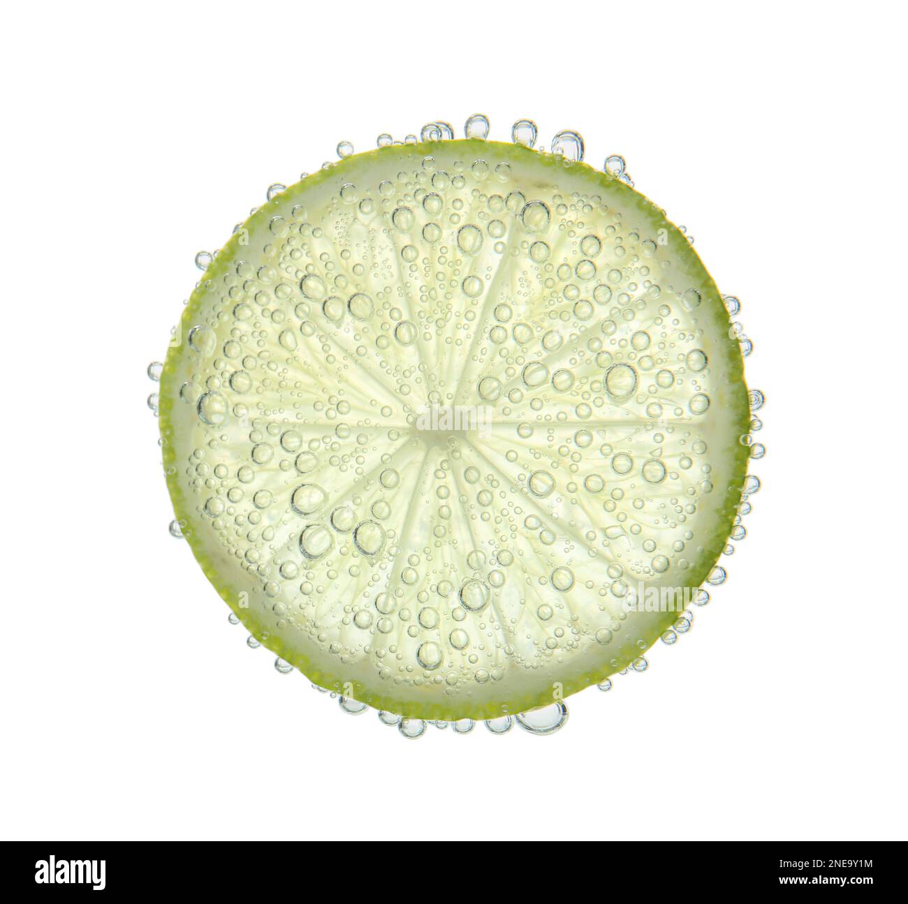 Fresh lime slice in sparkling water on white background Stock Photo - Alamy