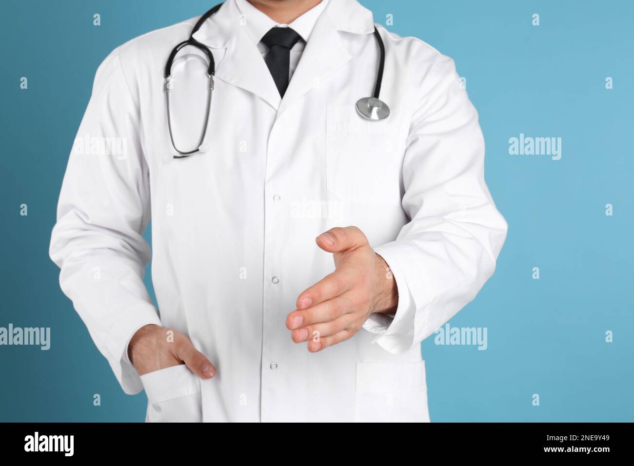 Doctor offering handshake on hi-res stock photography and images - Alamy