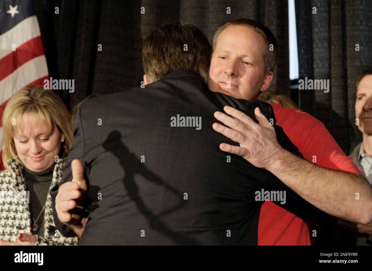 Jim Allen, 47, right, gets a hug after arriving at a small welcome home ...