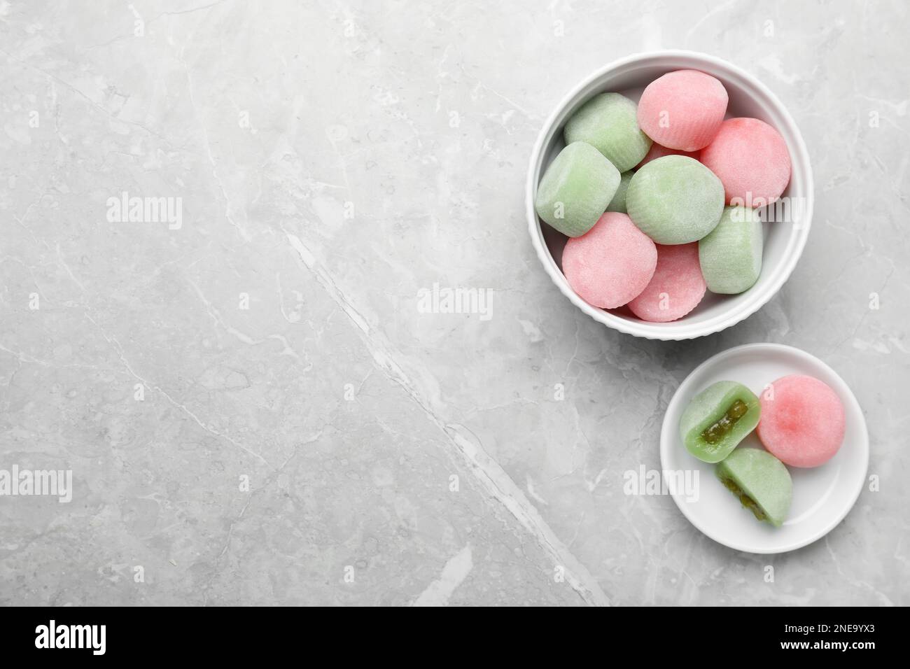 Delicious mochi on light grey marble table, flat lay with space for ...