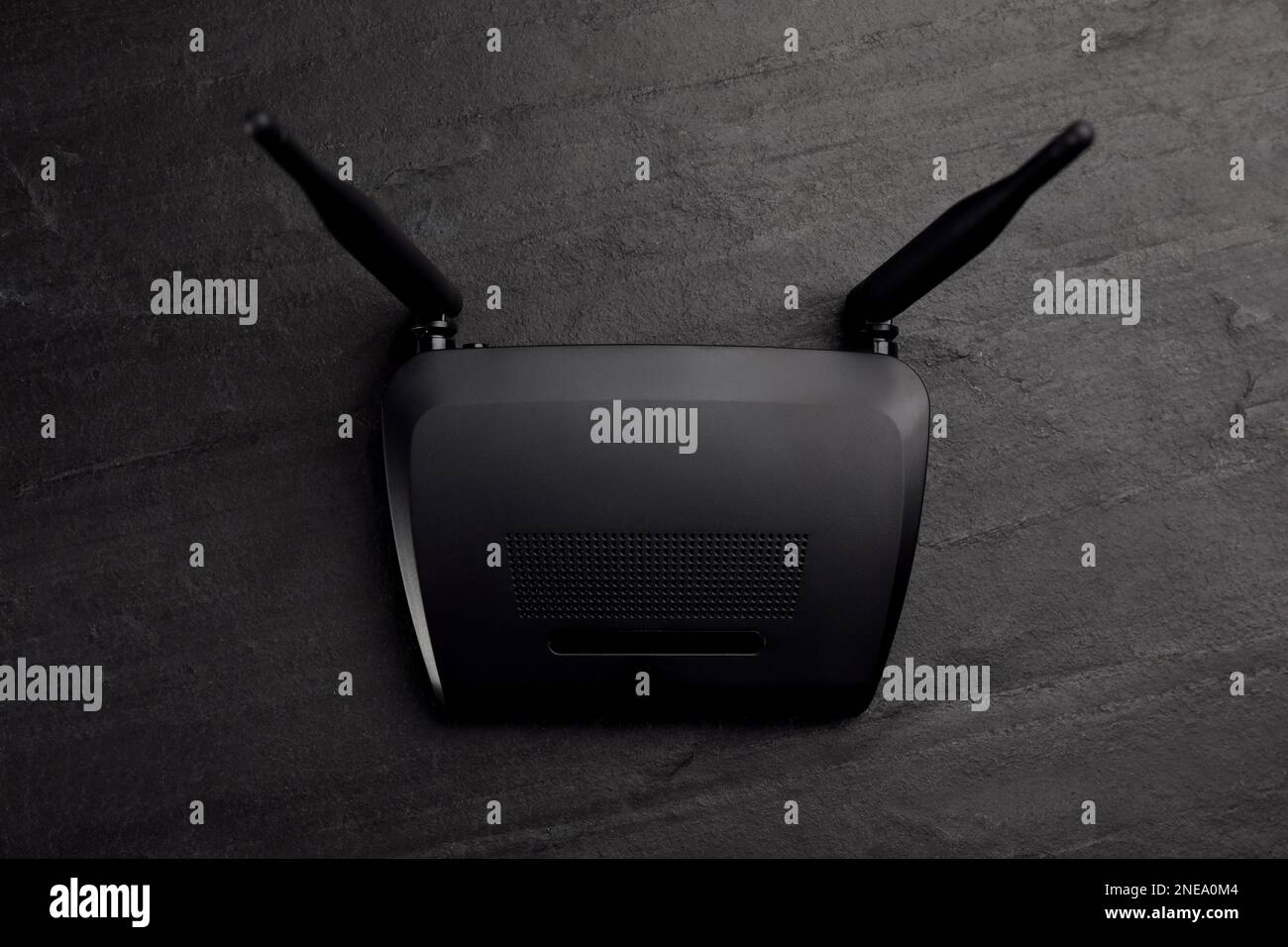 Modern Wi-Fi router on black background, top view Stock Photo - Alamy