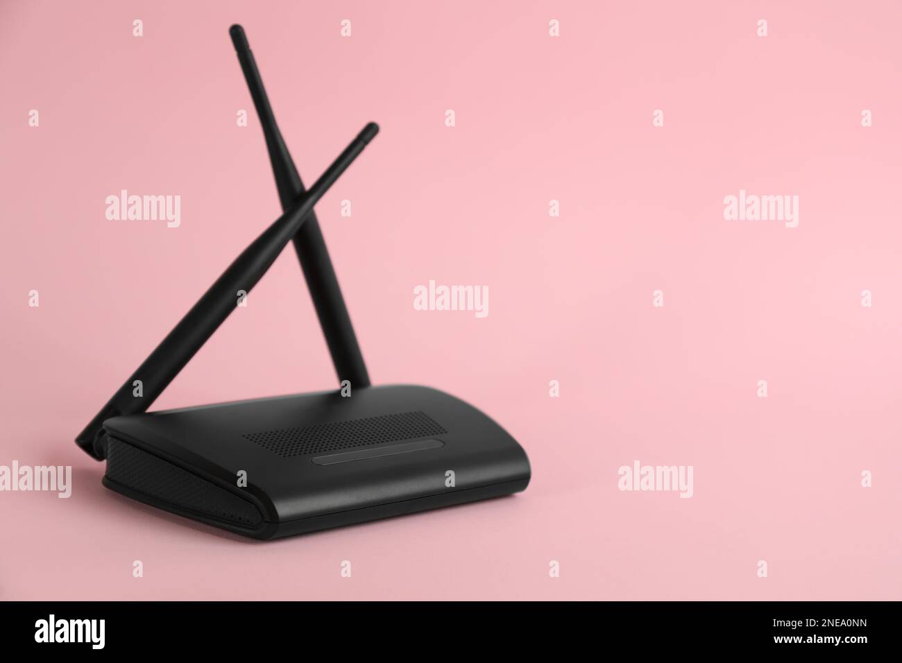 Modern Wi-Fi router on light pink background. Space for text Stock ...