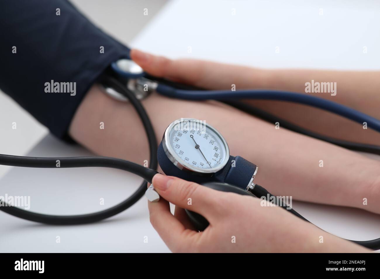 Doctor checking blood pressure of woman in clinic, closeup Stock Photo ...