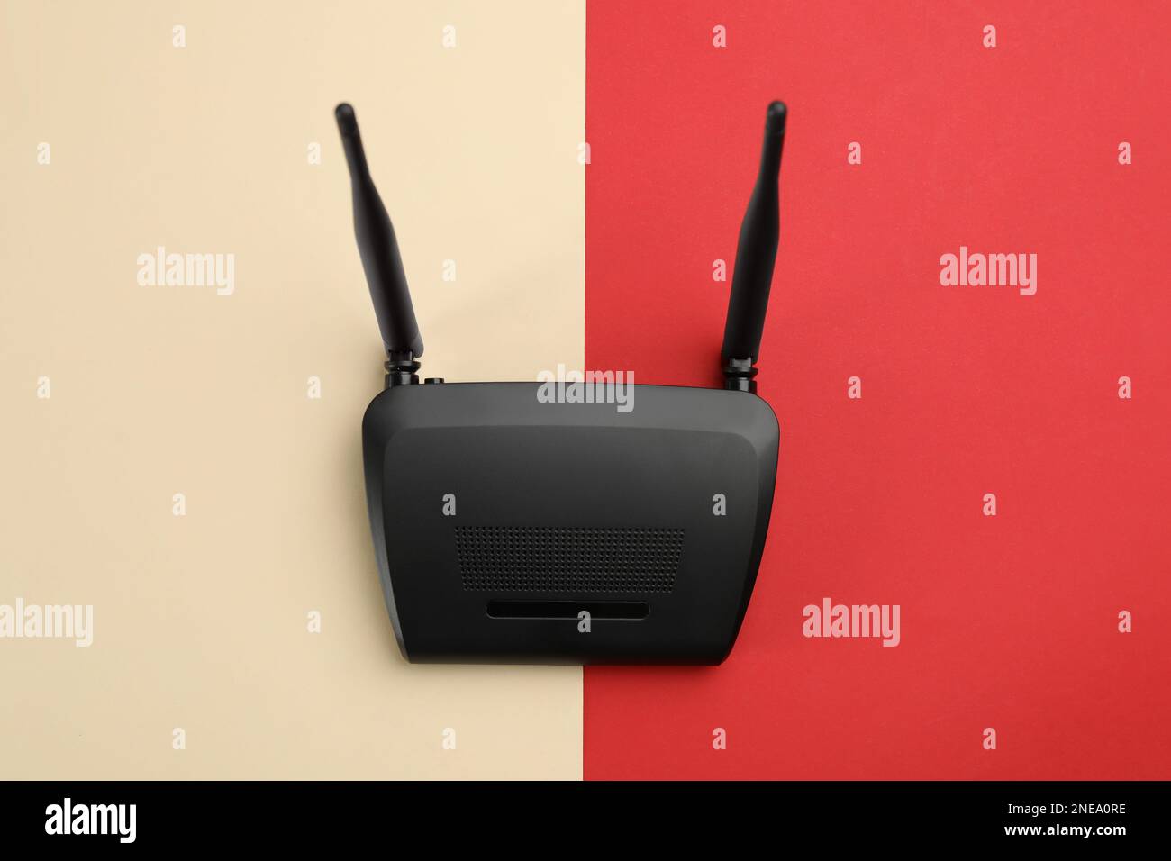 Modern Wi-Fi router on color background, top view Stock Photo - Alamy