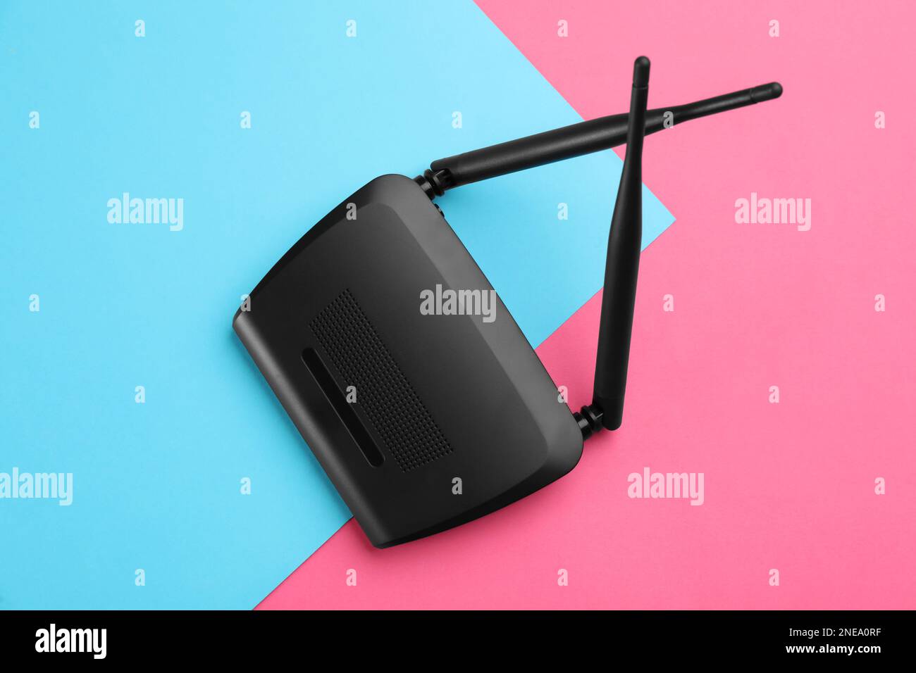 Modern Wi-Fi router on color background, top view Stock Photo - Alamy