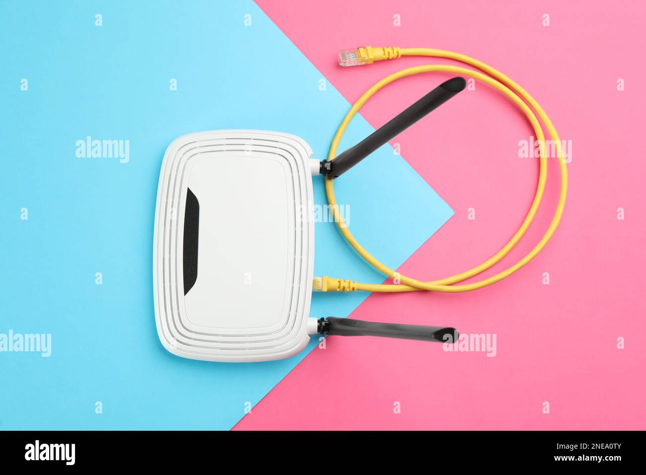 Modern Wi-Fi router on color background, top view Stock Photo - Alamy