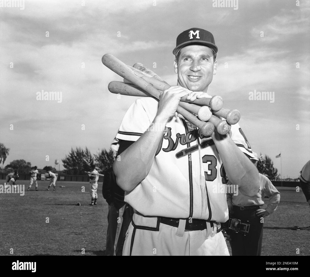 Bobby Thomson, erstwhile New York Giant centerfielder, shoulders bats ...