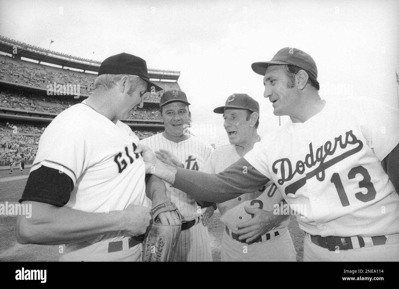 Four participants in the New York Mets old timers game engage in some ...