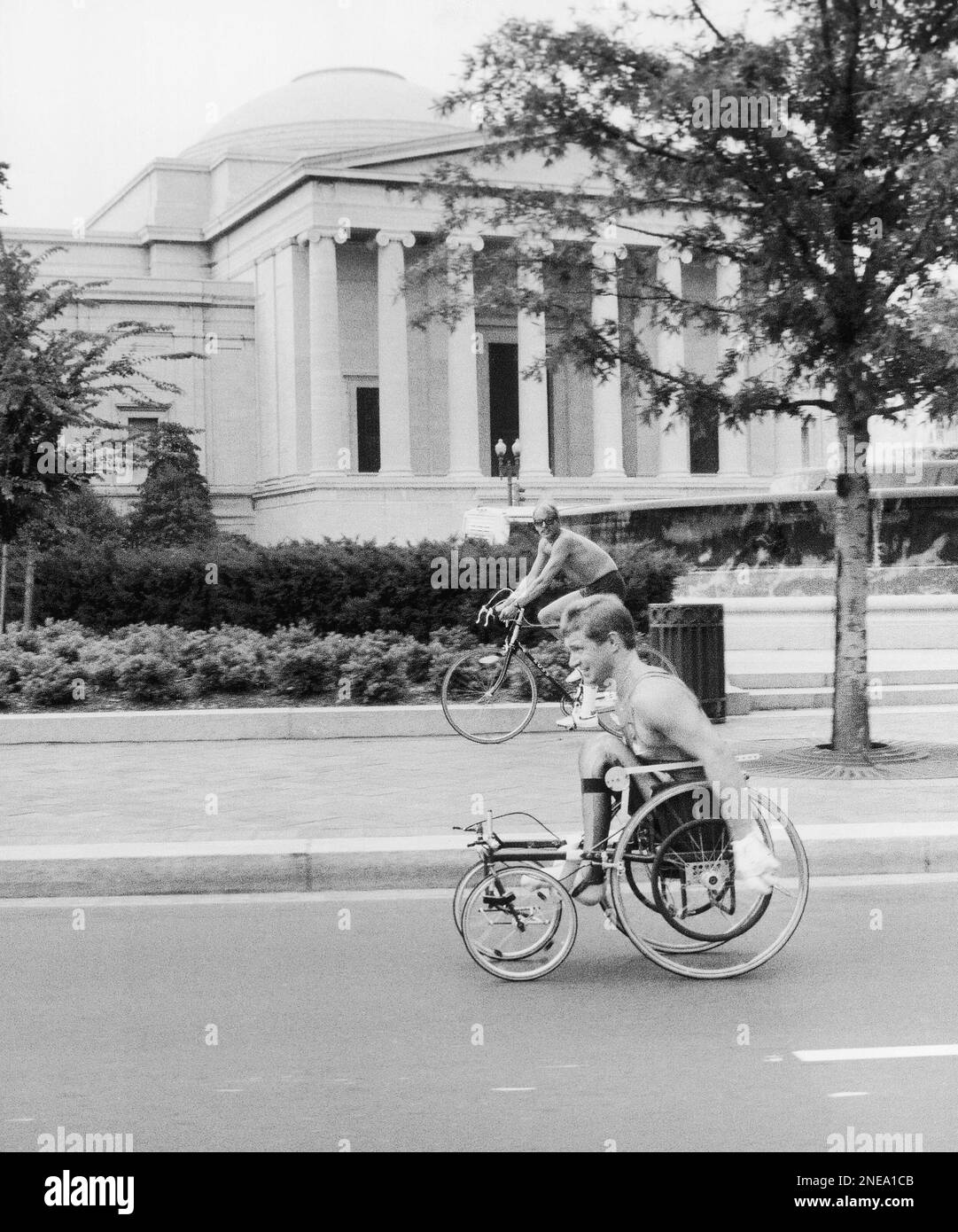 Rick Hansen, Canadian Olympian and wheelchair athlete, passes the ...