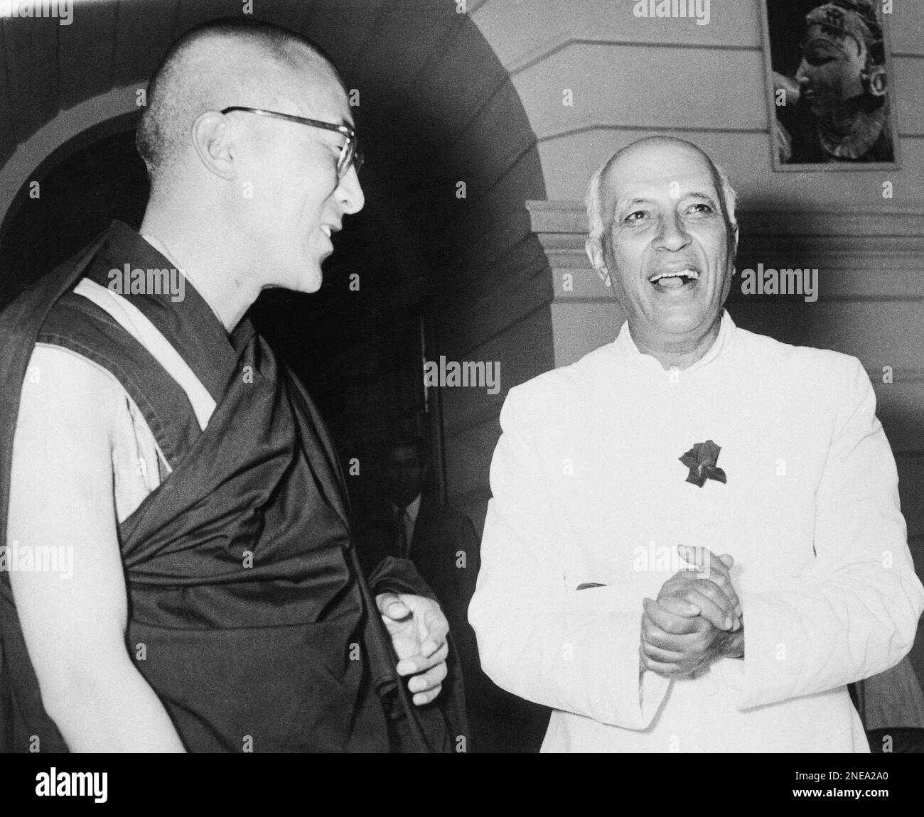 Prime Minister Jawaharlal Nehru clasps hands as he and the Dalai Lama ...