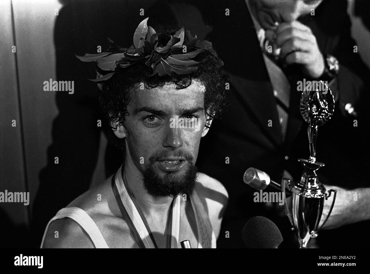 Neil Cusack of Limerick, Ireland holds the winner's trophy and wears a ...