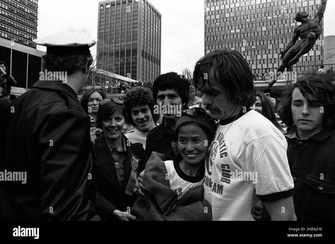Michiko Gorman of Los Angeles A.C. is hugged by her husband Michael ...