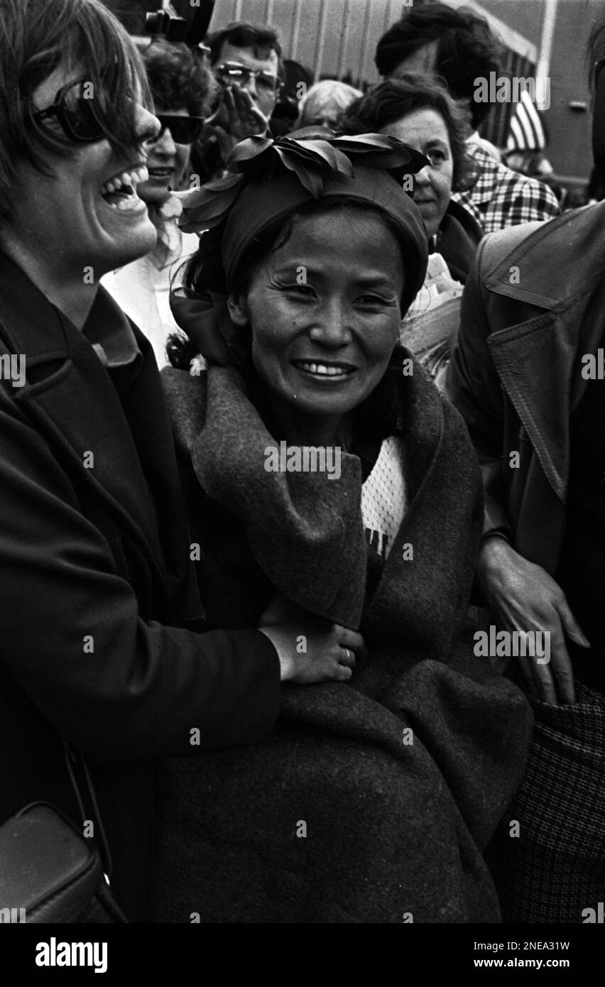 Michiko Gorman of Los Angeles A.C. is hugged by suporters as she became ...
