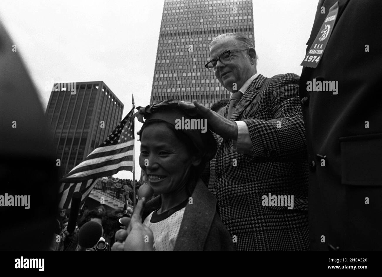 Boston Marathon's race director Will Cloney, places the laurel wreath ...