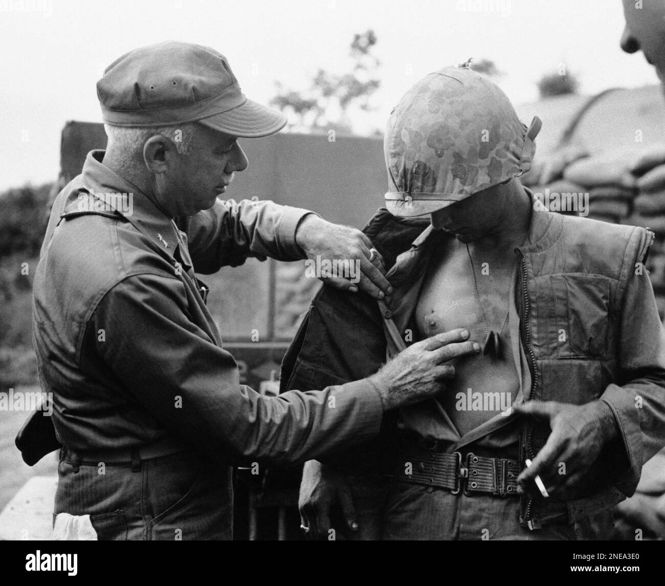 Corp. Robert L. Cameron of 822 1st Ave., Morris, Ill., bares his chest ...