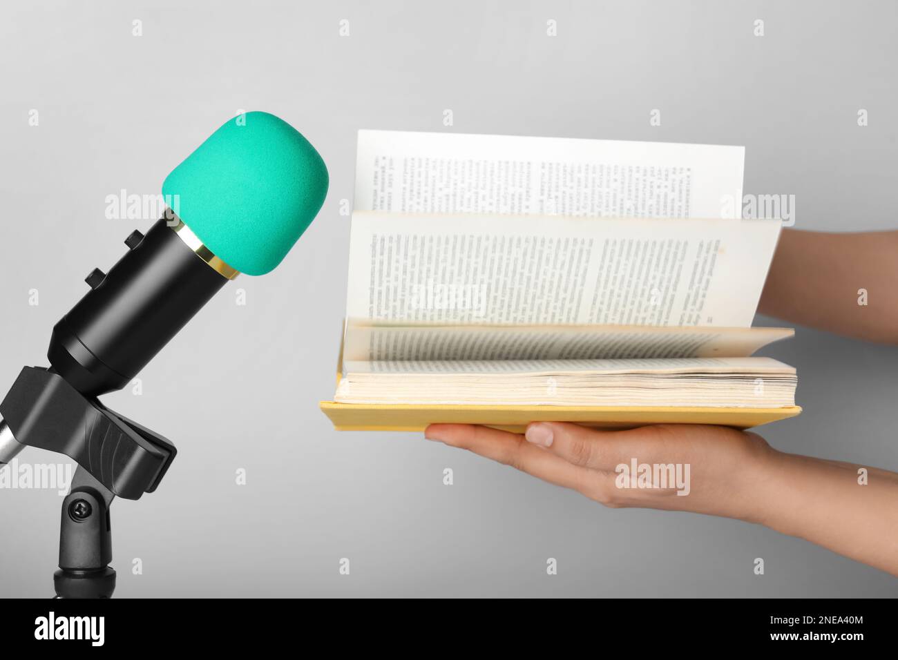 Woman microphone book hi-res stock photography and images - Alamy