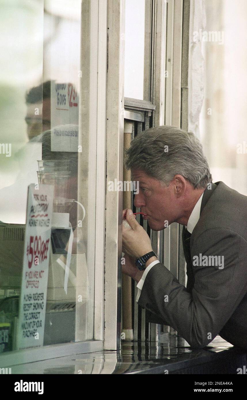 President Bill Clinton eats some custard at Leon's Frozen Custard Drive ...