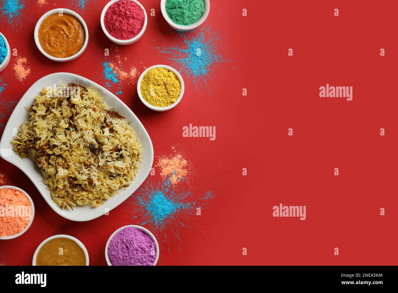 Flat lay of traditional Indian food and color powder dyes on red ...