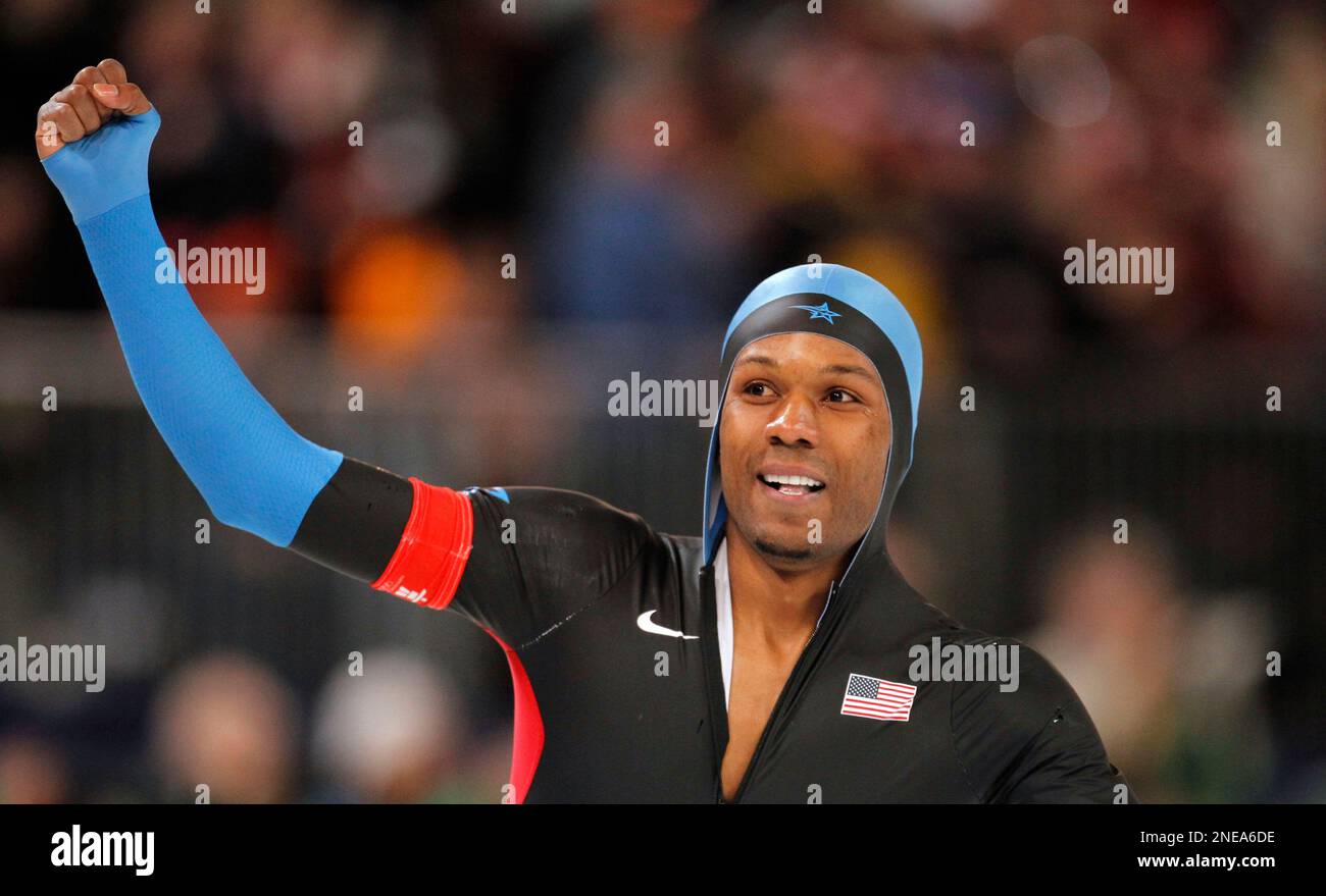 Gold medallist USA's Shani Davis reacts after crossing the finish line ...