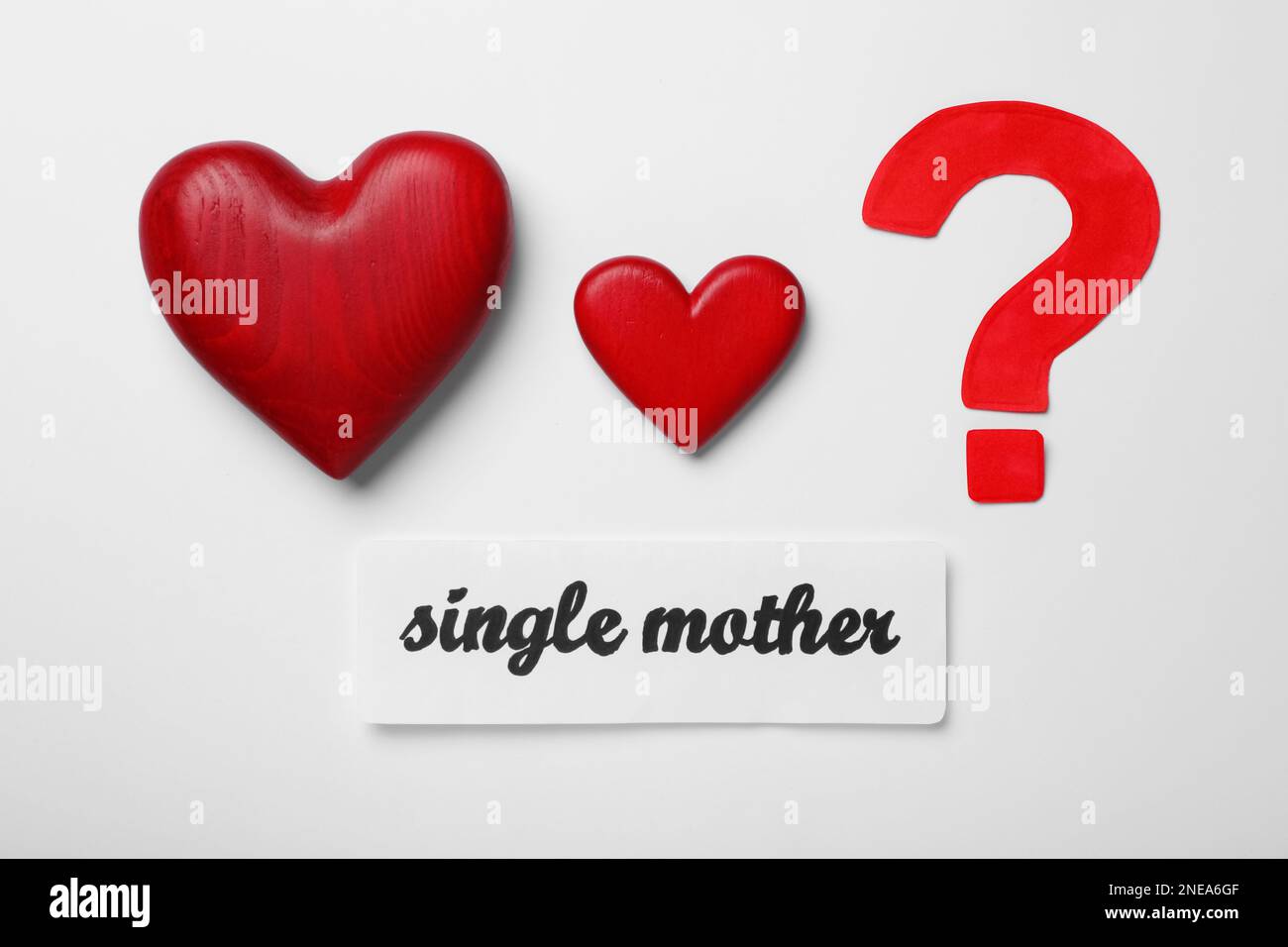 Being single mother concept. Decorative hearts and question mark on ...