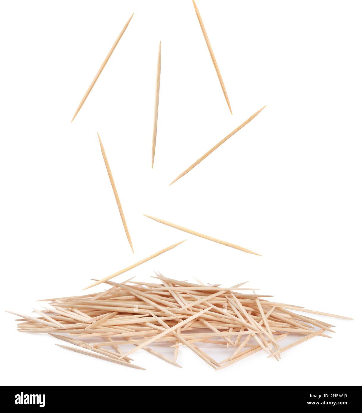 Wooden toothpicks falling into pile on white background Stock Photo - Alamy