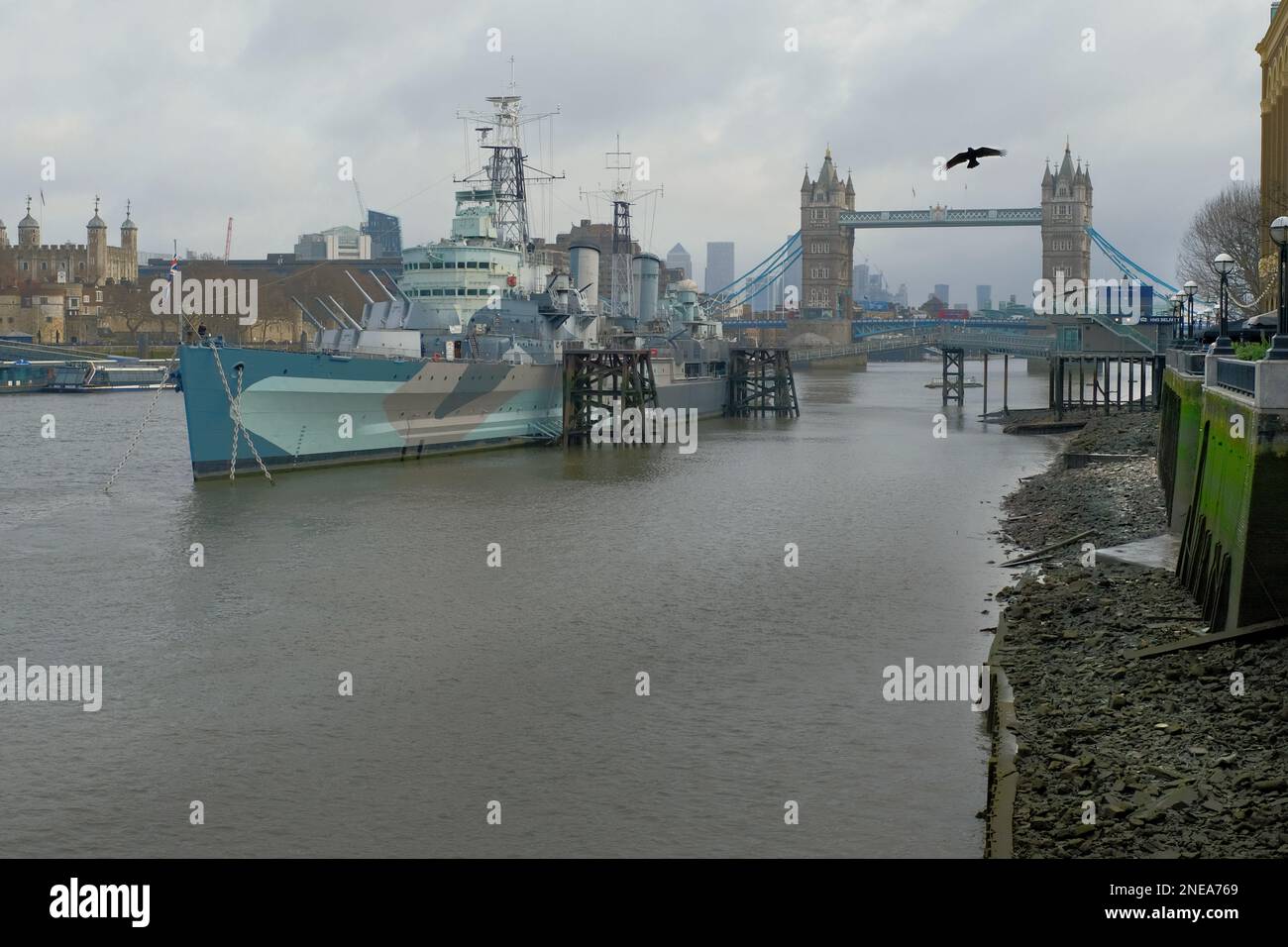 HMS Belfast on the River Thames with Tower Bridge in the background ...
