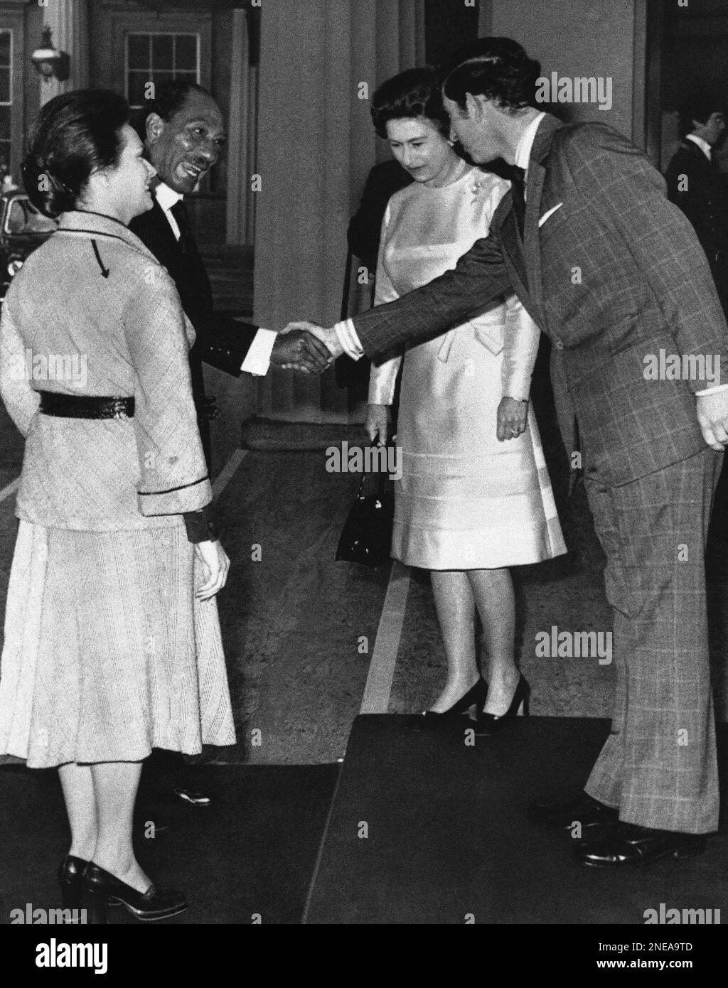 Prince Charles, right, greets Egyptian President Anwar Sadat on the ...