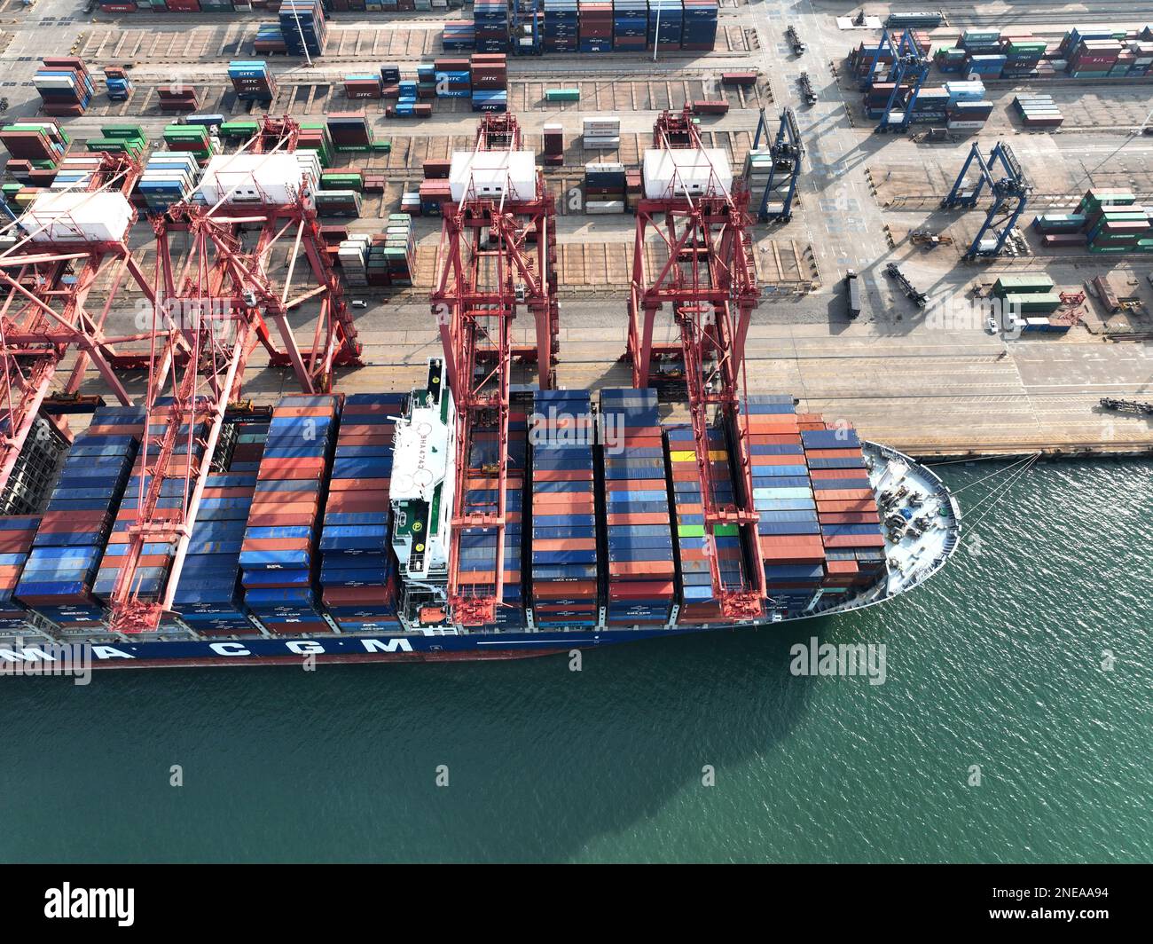 LIANYUNGANG, CHINA - FEBRUARY 16, 2023 - Cargo ships unload containers ...