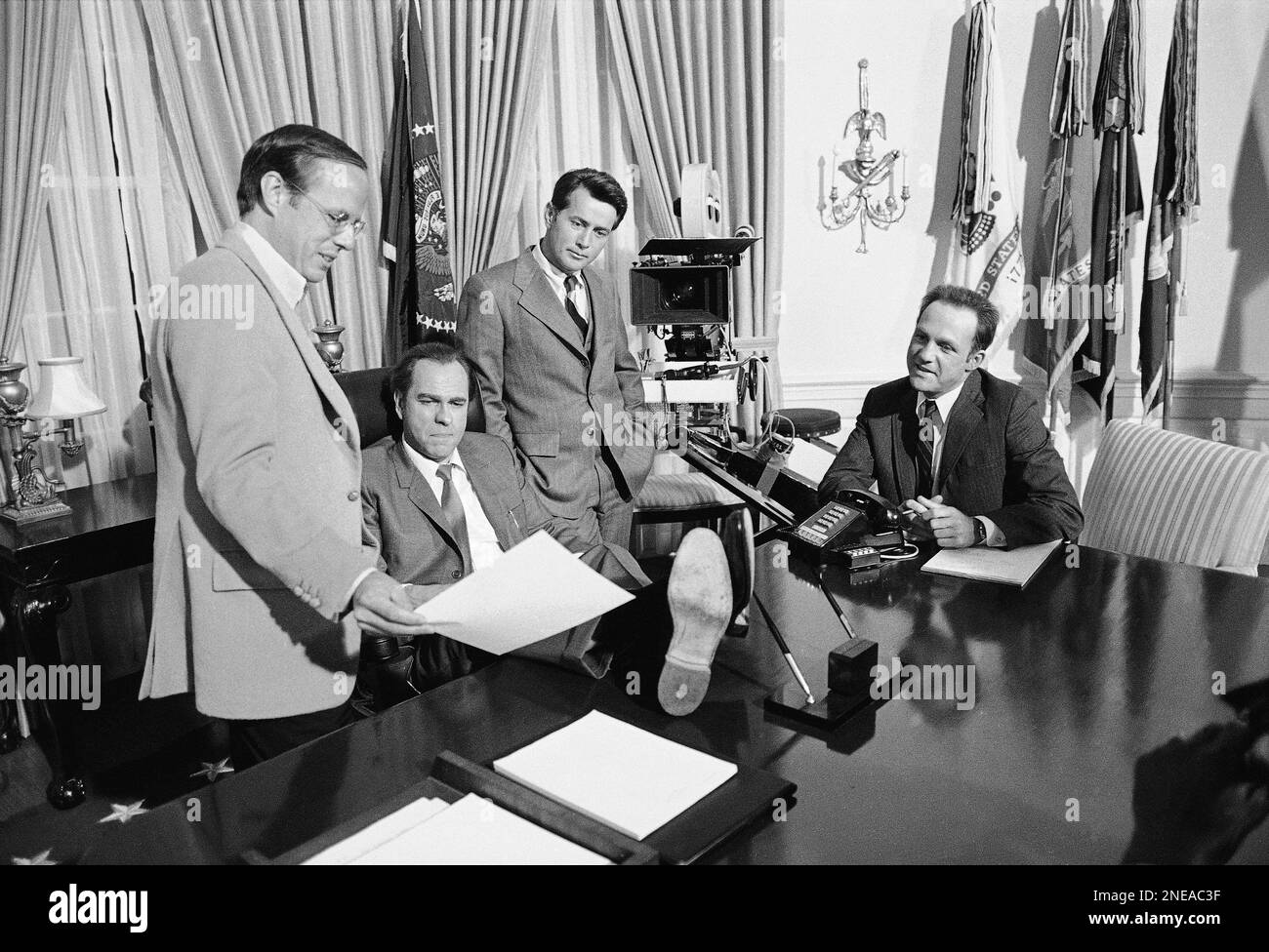 John Dean, left, confers with actors Rip Torn, playing the part of ...