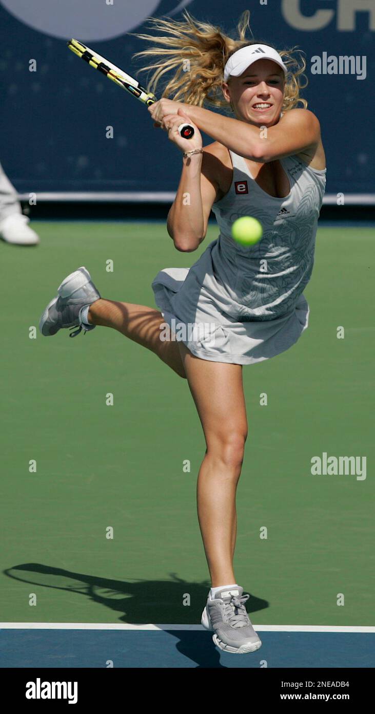 Denmark's Caroline Wozniacki returns the ball to Israel's Shahar Peer ...