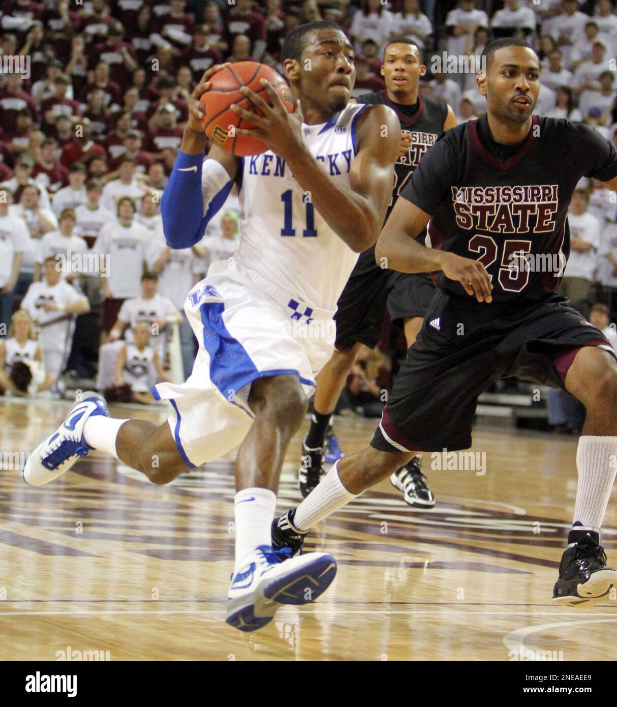 Kentucky guard John Wall (11) drives past Mississippi State guard Phil ...