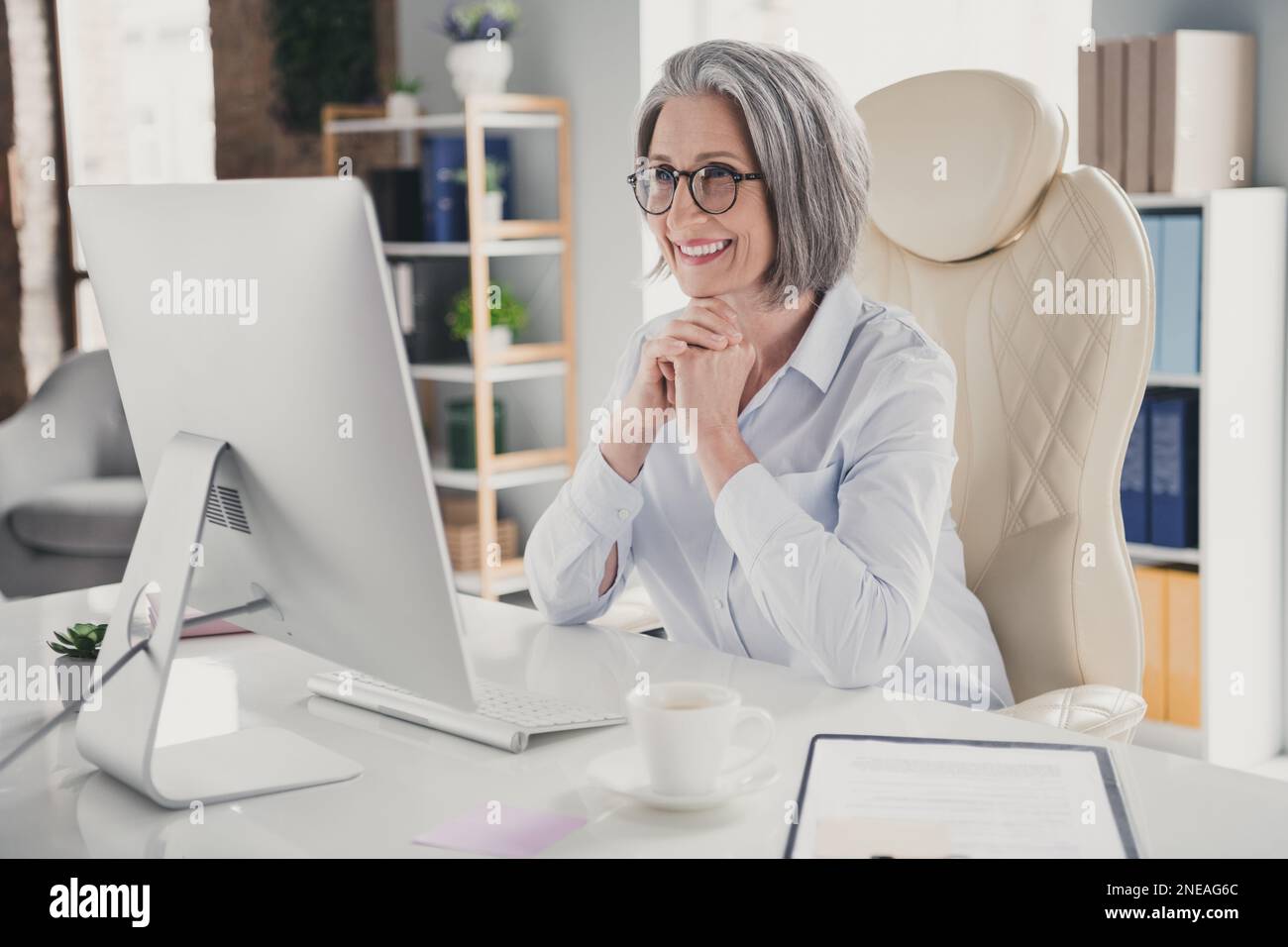 Photo of positive smiling lady boss wear white shirt eyeglasses reading ...
